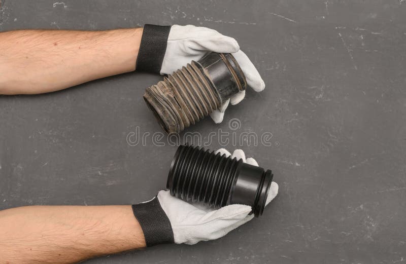 Cover for a Car Shock Absorber. New and Worn in the Hands Stock Photo ...