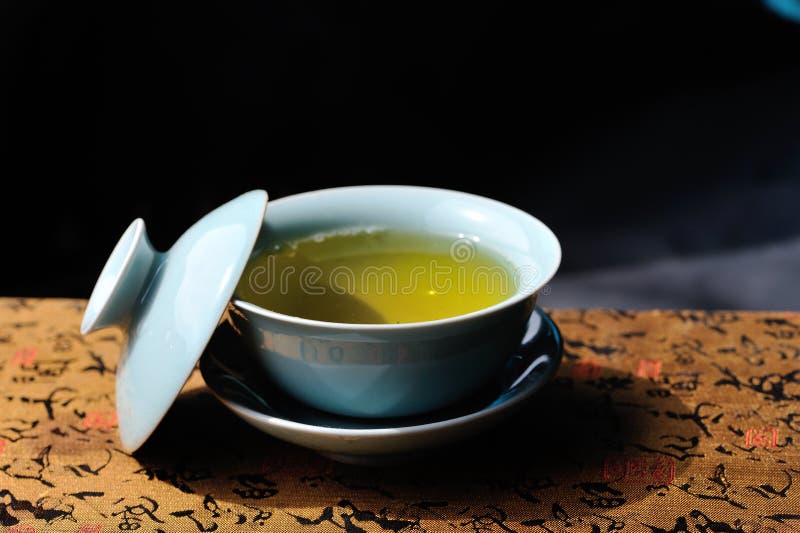 Covered bowl with tea stock photo. Image of calm, brown - 67789808