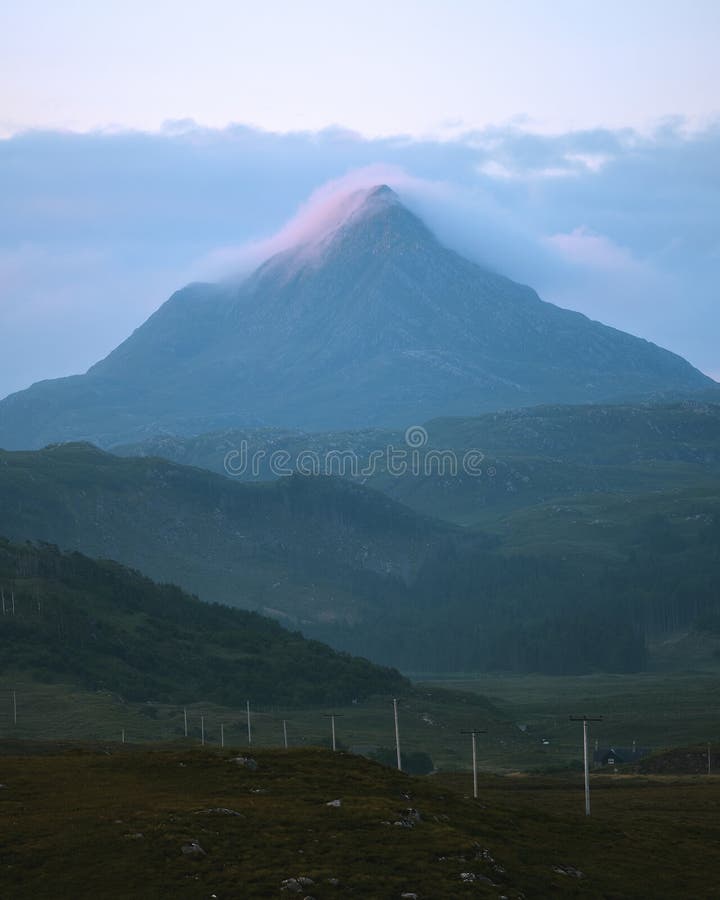 Covered by Clouds Illuminated by the Rising Sun, the Summit of Mount ...