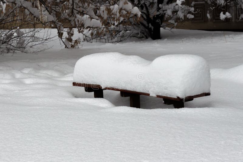 Covered with a Large Layer of Snow Bench in the City Park Stock Photo ...
