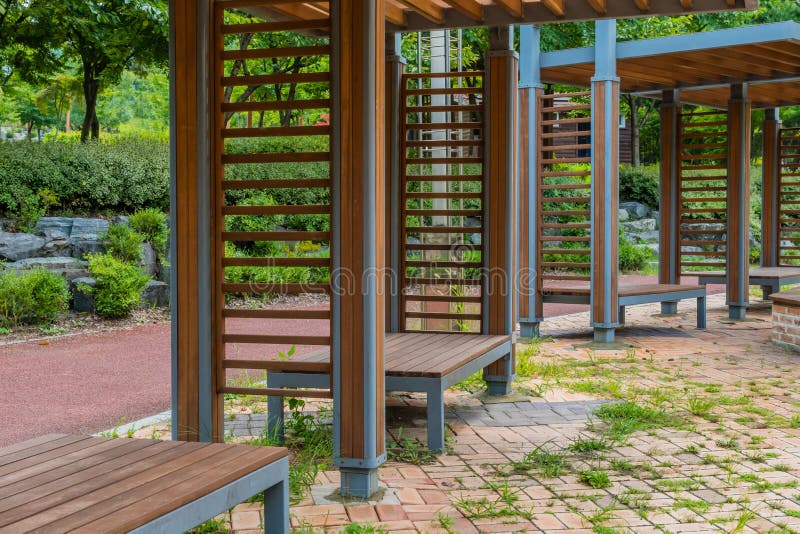 Covered Park Benches on Brick Patio Stock Image - Image of patio ...