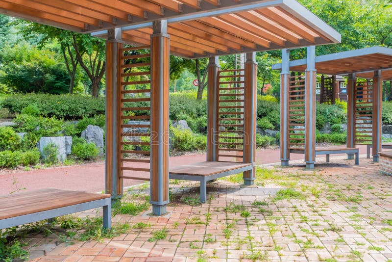 Covered Park Benches on Brick Patio Stock Image - Image of patio ...