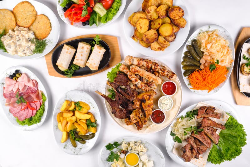 A Covered Table with Many Different Dinner Dishes. Lots of Food on a ...