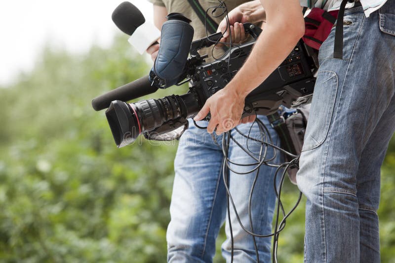 Cameraman filming editorial stock photo. Image of microphone - 15911778