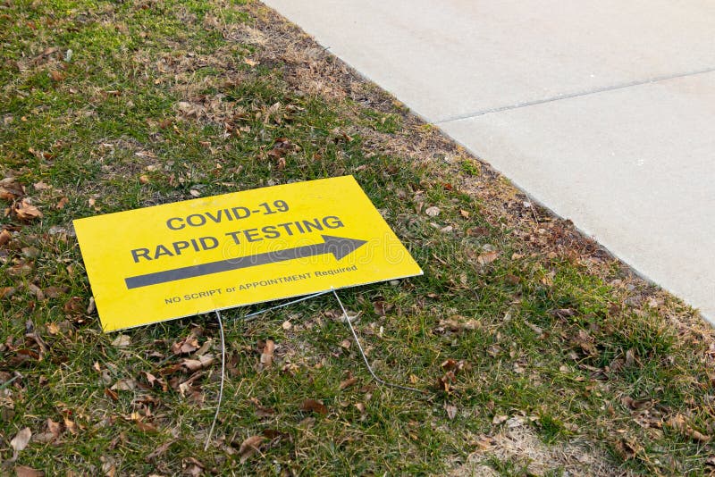 COVID-19 Pandemic Rapid Testing Site Sign Laying on the Ground Stock ...