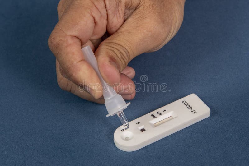 Covid-19 Rapid Test with Person Dripping the Reagent Stock Image ...
