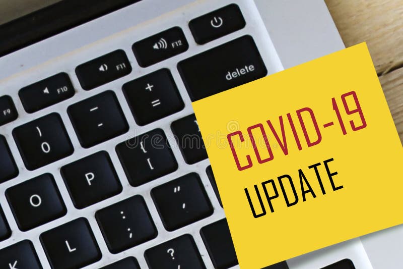 COVID-19 UPDATE Sticker Text on Laptop Keyboard Stock Image - Image of ...