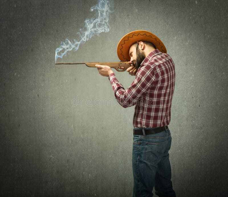 Cow Boy Shot with Rifle in Profile View Stock Image - Image of intense ...