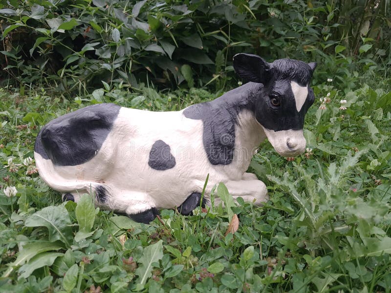 Cow figure in grass stock image. Image of cattle, lawn - 328920141
