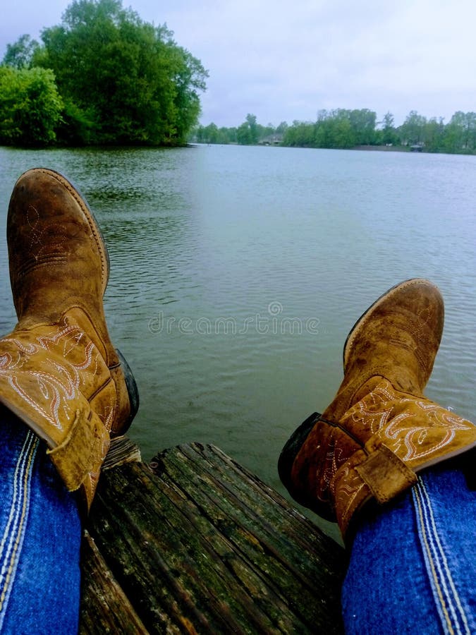 Cowboy Boots Fishing by the Water Stock Photo - Image of water, vehicle ...