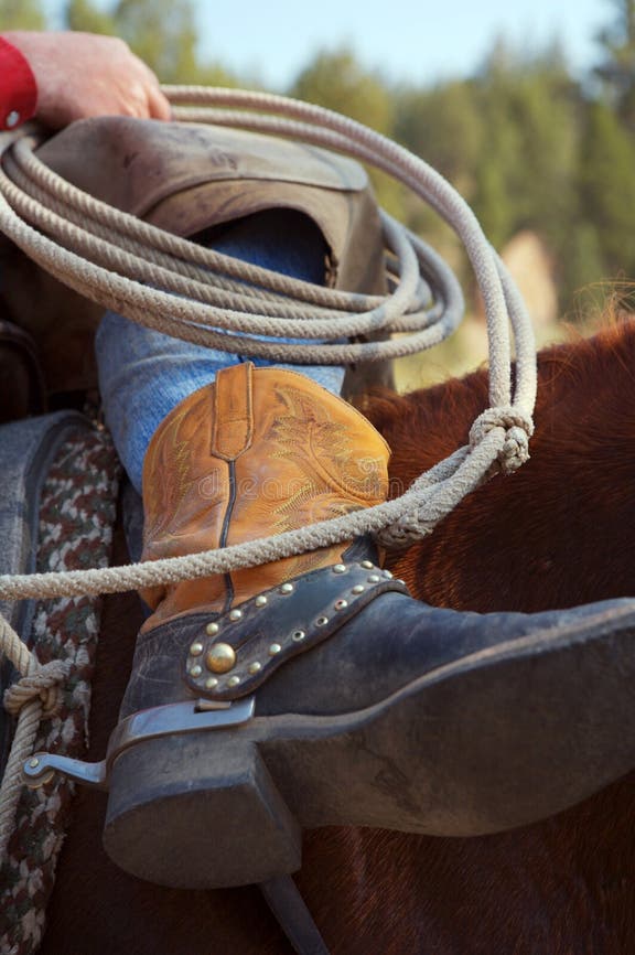 Cowboy Boots and Ropes stock photo. Image of outside, saddle - 1969200