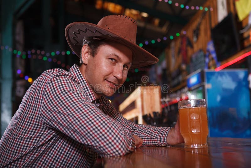Cowboy Drinking Beer at the Saloon Stock Image - Image of beer, western ...