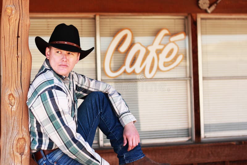 Cowboy in Front of Cafe stock image. Image of blue, attractive - 23408629
