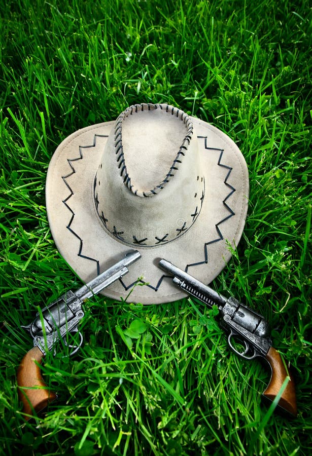 Cowboy hat and two guns stock image. Image of handgun - 19561753