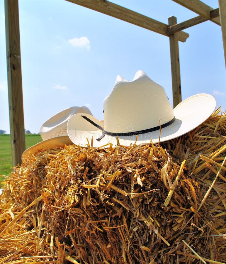 Cowboy Hats on Hay stock photo. Image of farm, post, bail - 14961646