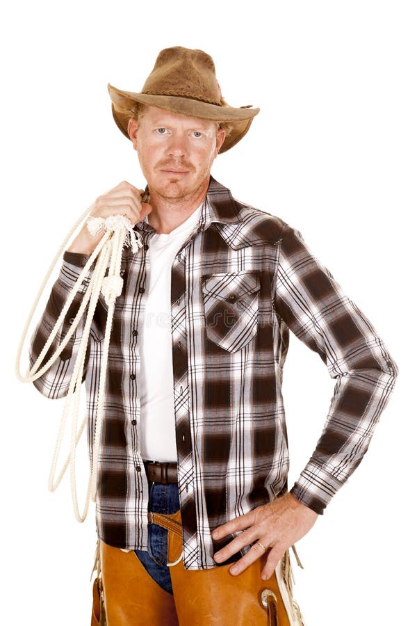 Cowboy Holding Rope Over Shoulder Looking Stock Photo - Image of middle ...