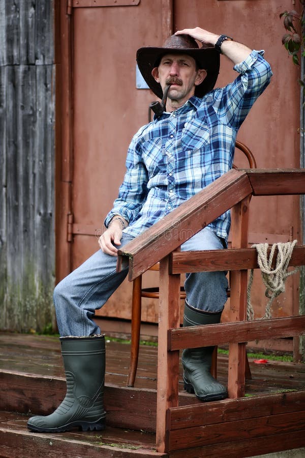 Cowboy man smoke pipe stock image. Image of house, casual - 79128513