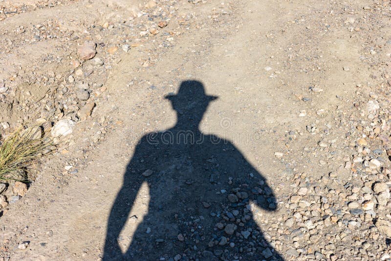 Cowboy shadow on rock stock photo. Image of wall, shadow - 23103674
