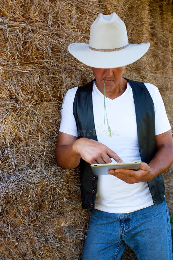 Cowboy Using Touch Screen of Tablet Computer Stock Photo - Image of ...