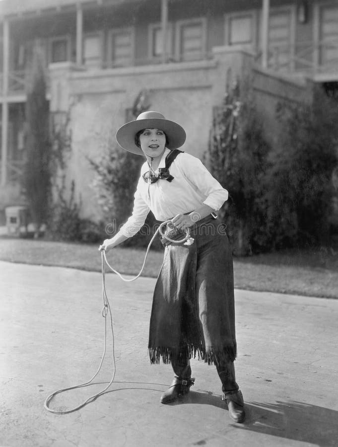 Cowgirl using lasso stock photo. Image of daytime, activities - 51999428