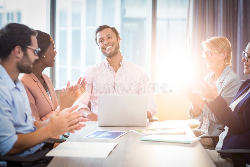 Coworkers Applauding a Colleague after Presentation Stock Photo - Image ...