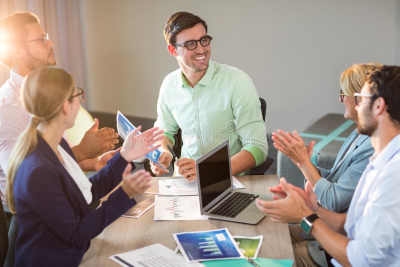 Coworkers Applauding a Colleague after Presentation Stock Image - Image ...