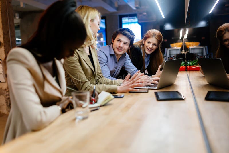 Coworkers bonding in pub stock photo. Image of corporate - 104060442