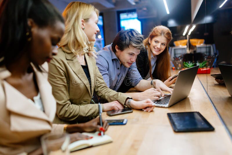 Coworkers bonding in pub stock photo. Image of glass - 125503586