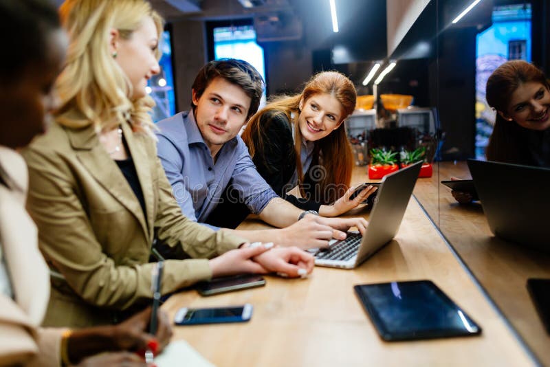 Coworkers bonding in pub stock photo. Image of indoors - 69869820