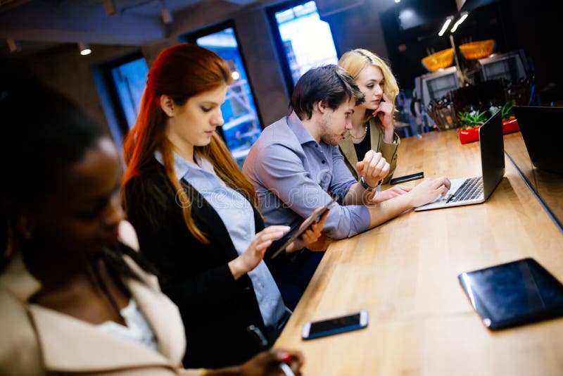 Coworkers bonding in pub stock image. Image of drink - 99097691