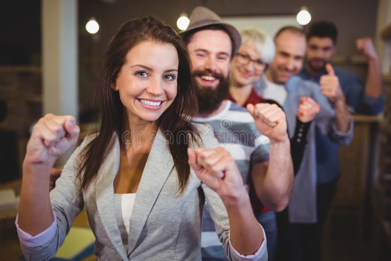 Excited Coworkers Giving High-five at Creative Office Stock Photo ...