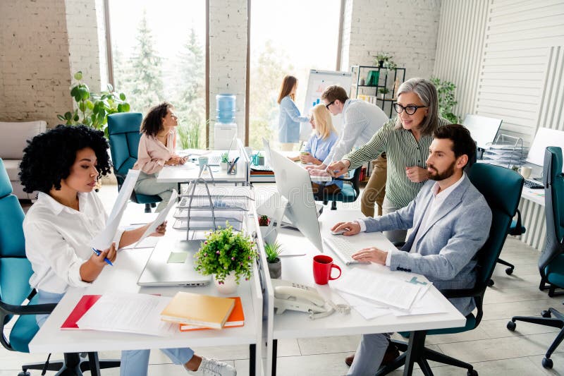 Coworkers Collaborating in Modern Open Space Office with Focus on ...