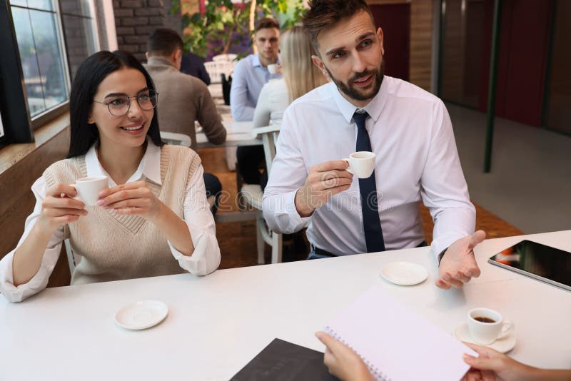 Coworkers Enjoying Coffee during Break in Cafe Stock Image - Image of ...