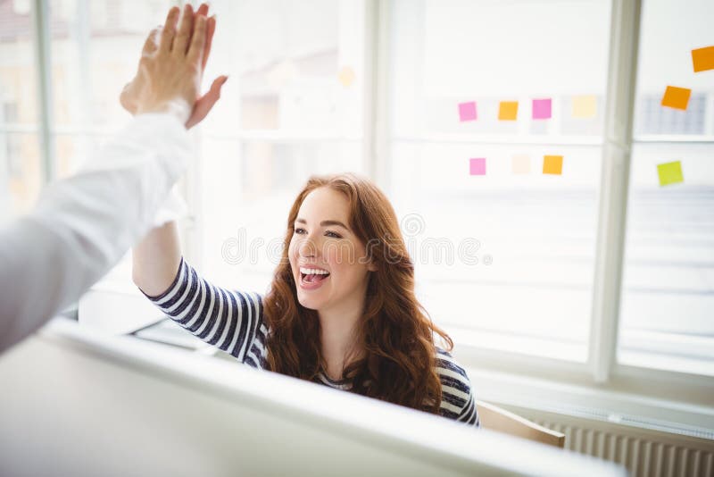 Excited Creative Business People Giving High-five Stock Image - Image ...