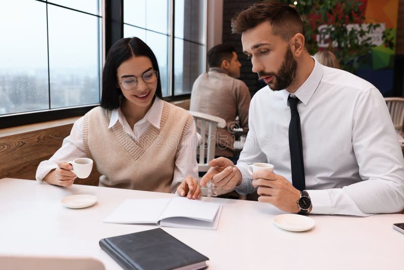 Coworkers Talking in Cafe during Coffee Break Stock Image - Image of ...