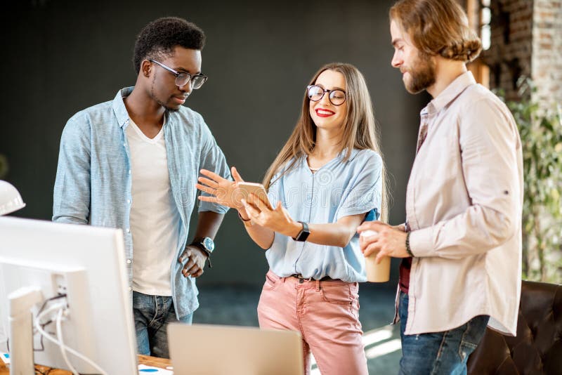 Coworkers talking indoors stock photo. Image of people - 92235358