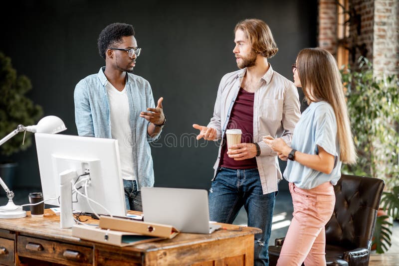 Coworkers talking indoors stock photo. Image of people - 92235358