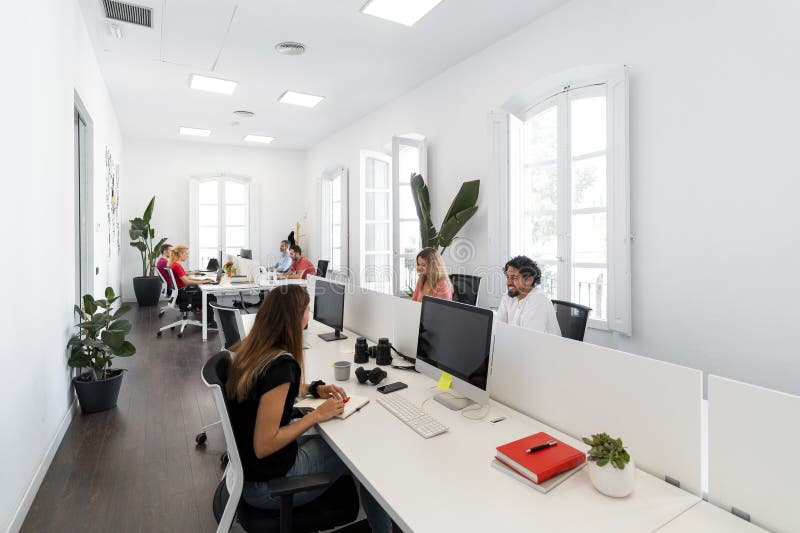 Coworkers Working on Computers in Modern Open Space Office Stock Image ...