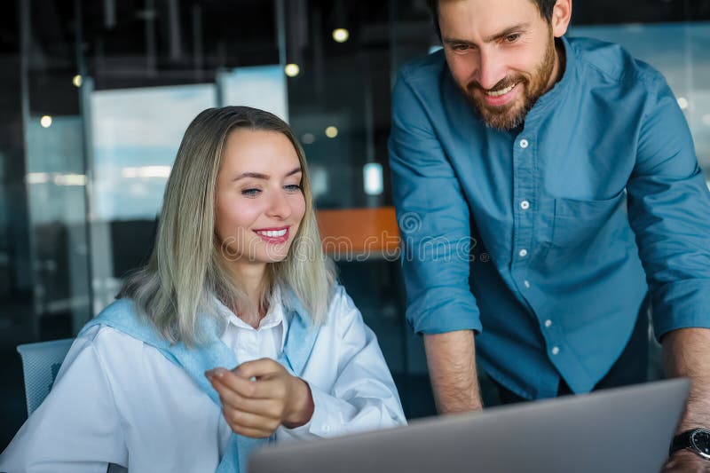 Coworkers Working on a Project and Looking Interested Stock Photo ...