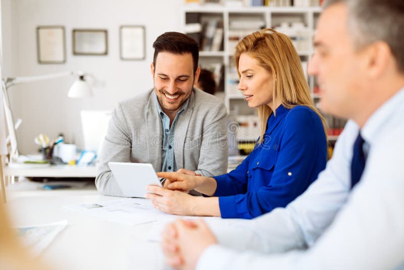 Coworkers Working on Project Together in Office Stock Image - Image of ...