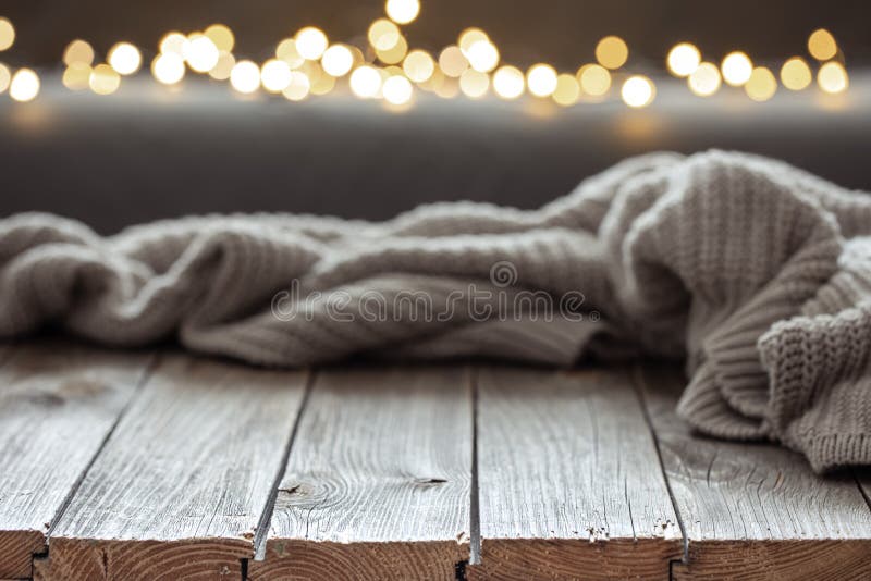 Cozy Background with Knitted Element on a Wooden Surface and Bokeh ...