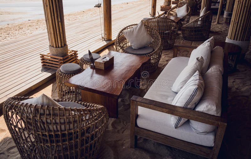 A Cozy Beach Cafe with Couch and Rustic Chairs Stock Image - Image of ...