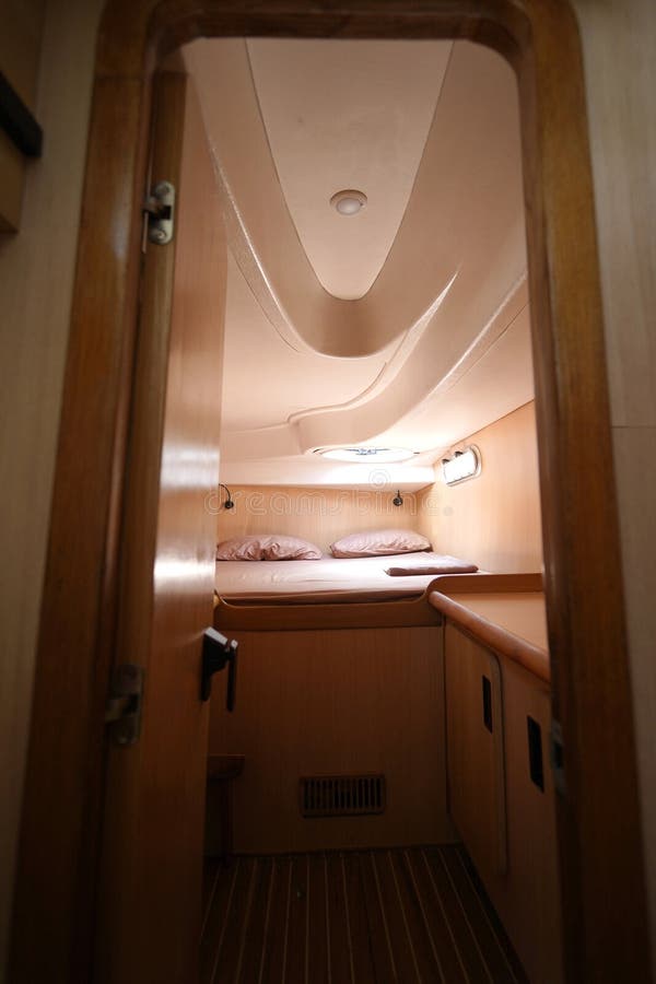 Cozy Bed on a Voyage Boat with a Window Overhead with Natural Light ...