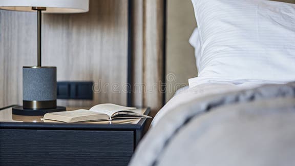 Cozy Bedroom with Bedside Table and Open Book Stock Photo - Image of ...