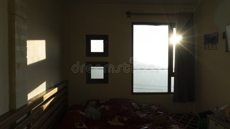 Sunlit Bedroom with Cozy Bed and Mountain View through Window Stock ...