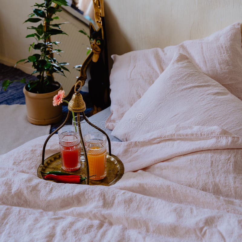 Cozy Bedroom Interior with Fresh Juices on the Bed Stock Image - Image ...