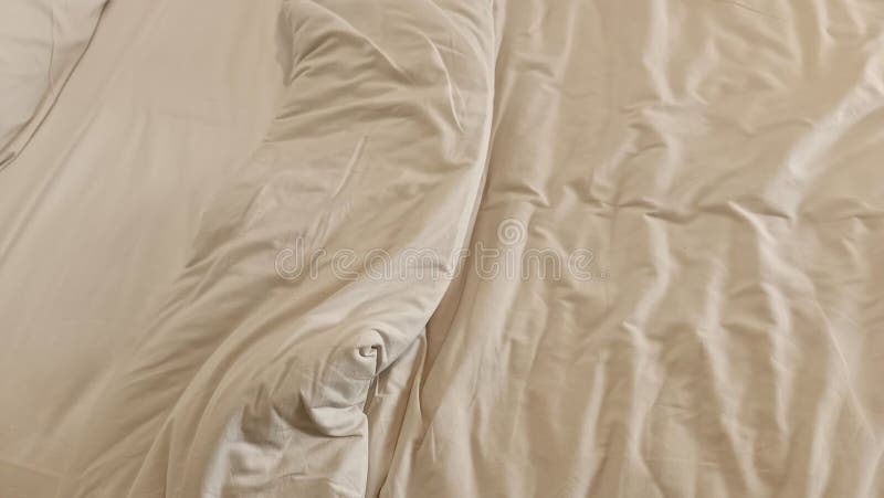 Cozy Beige Bed Linen with Soft Wrinkled Texture Stock Photo - Image of ...