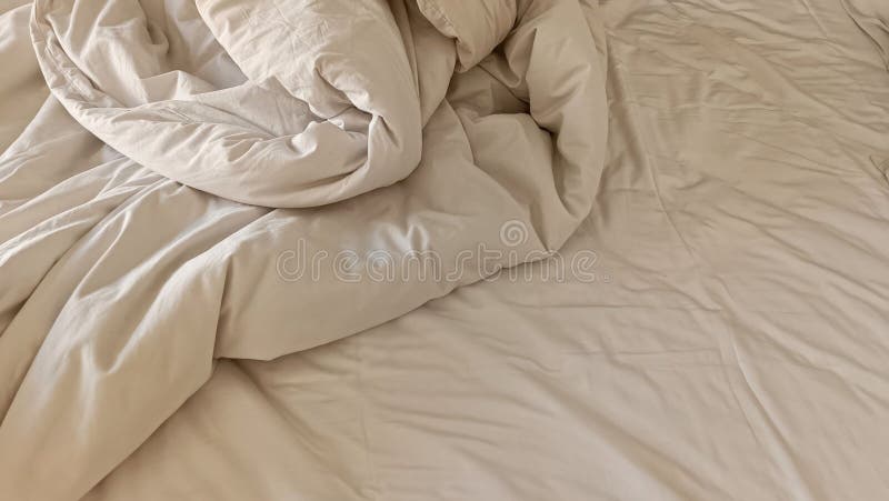 Cozy Beige Bedding with Wrinkled Texture in Bedroom Stock Photo - Image ...