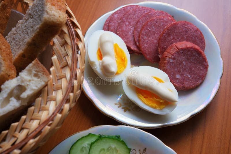 Cozy Breakfast with Boiled Eggs, Cold Cuts, and Fresh Bread Stock Image ...