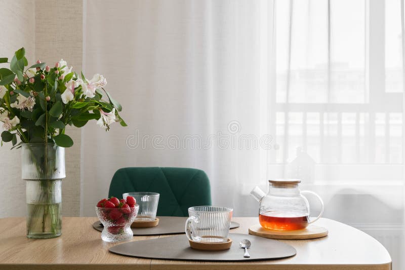 A Cozy Breakfast Setting Featuring Tea and an Array of Fresh, Juicy ...
